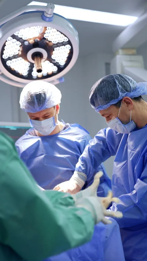Male surgical team working in the surger... | Stock Video | Pond5