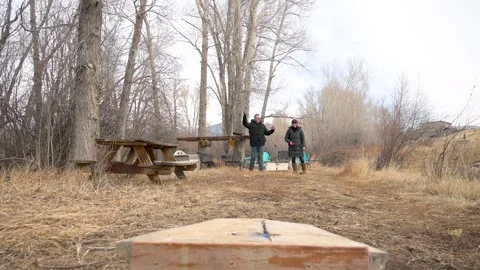 Male throwing a cornhole bag into a corn... | Stock Video | Pond5