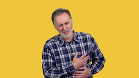 Male touching his chest because of heart... | Stock Video | Pond5