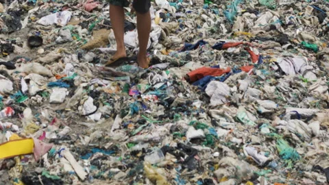 male walking in landfill trash waste pol... | Stock Video | Pond5