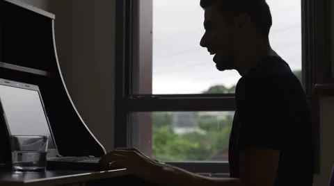 Male watching funny stand-up show on lap... | Stock Video | Pond5