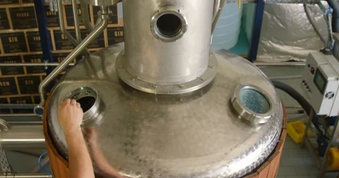 Male worker examining a distillation tan... | Stock Video | Pond5