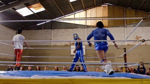 Male wrestlers fight in a boxing ring in... | Stock Video | Pond5