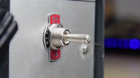 Man activates a toggle switch by turning... | Stock Video | Pond5