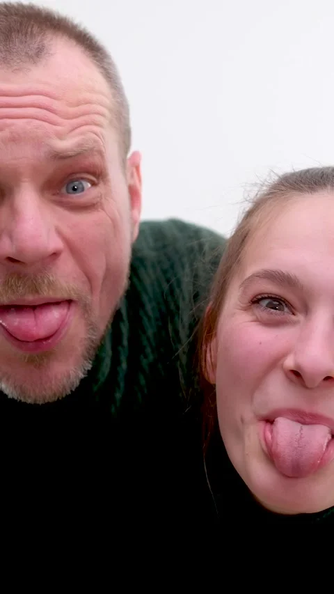 man and girl leaned over and stuck out t... | Stock Video | Pond5