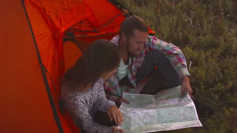 A man and a woman are planning a mountai... | Stock Video | Pond5