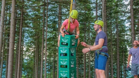 Man and woman build tower with beer bag ... | Stock Video | Pond5