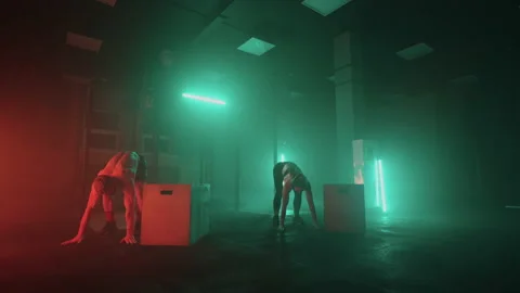 A man and a woman jump over a box perfor... | Stock Video | Pond5