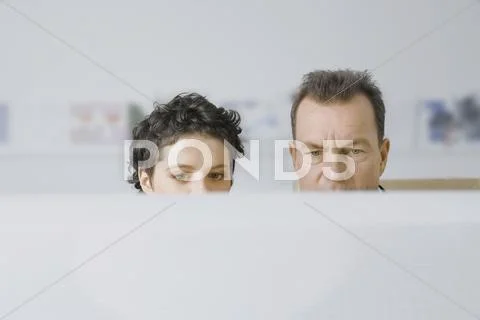 Man And Woman Looking At Computer Monitor - Stock Image - Everypixel