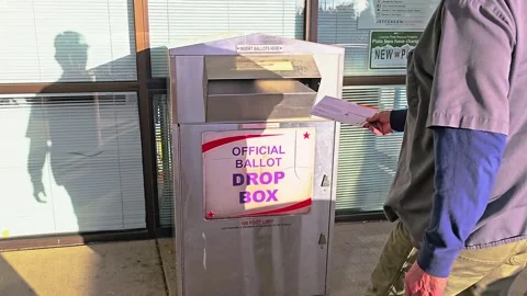 Man and Woman Vote in Election by Mail a... | Stock Video | Pond5