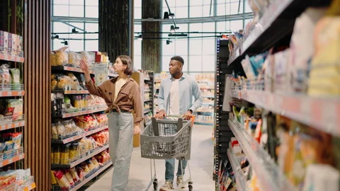 Man and woman walk around grocery store ... | Stock Video | Pond5