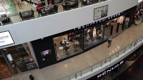 Man and woman walk inside Dizengoff Cent... | Stock Video | Pond5