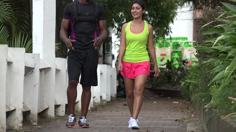 Man And Woman Walking For Exercise | Stock Video | Pond5