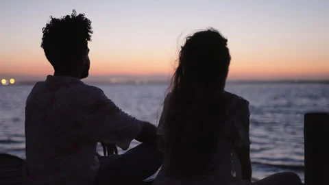Man and woman watch the sea at the end o... | Stock Video | Pond5