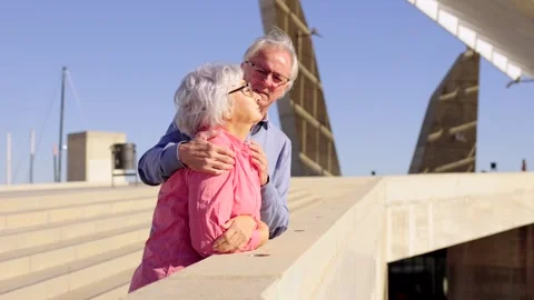 Man approaching to his wife enjoying the... | Stock Video | Pond5