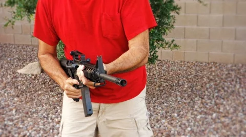 Man with AR-15 Quickly Loads a New Magaz... | Stock Video | Pond5