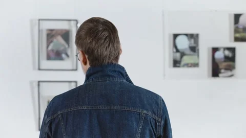 A man in an art gallery, view from the b... | Stock Video | Pond5