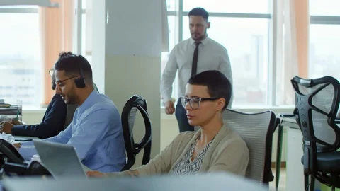Man Asking Question to Colleague in Offi... | Stock Video | Pond5