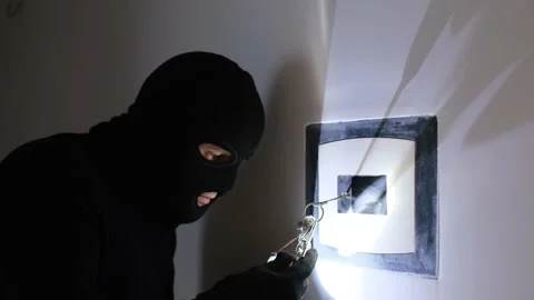 A man in a black mask breaks into a bank... | Stock Video | Pond5