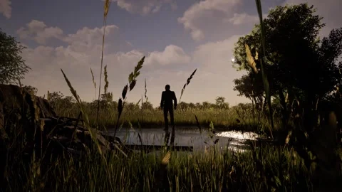 a man in black standing on a forest clea... | Stock Video | Pond5