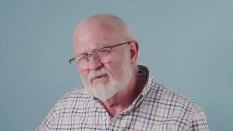 Man with Blue Backdrop Gives Questionabl... | Stock Video | Pond5