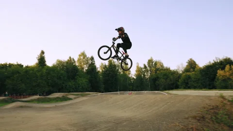 man on BMX bike is performing tricks on ... | Stock Video | Pond5