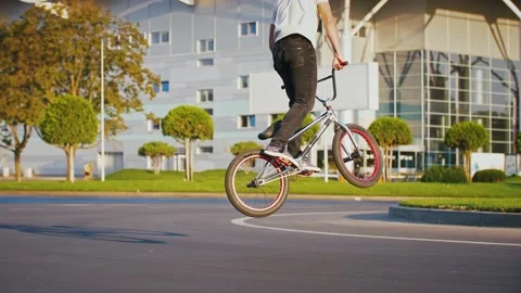 Man bmx rider is jumping and spinning on... | Stock Video | Pond5