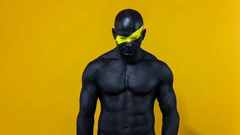 Man bodybuilder athlete with yellow colo... | Stock Video | Pond5