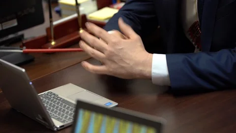 A man / boss in an office/business suit ... | Stock Video | Pond5