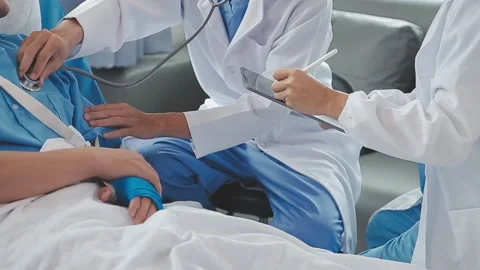 Man with broken arm in cast lying on bed... | Stock Video | Pond5