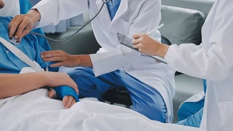 Man with broken arm in cast lying on bed... | Stock Video | Pond5