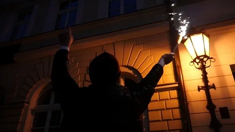 Man with burning Bengal Torch walking Ha... | Stock Video | Pond5