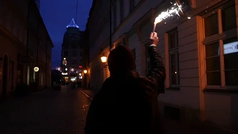 Man with burning Bengal Torch walking Ha... | Stock Video | Pond5