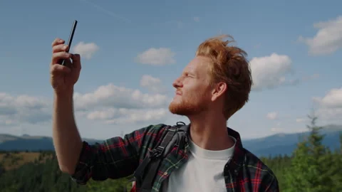 Man catching mobile phone signal in moun... | Stock Video | Pond5