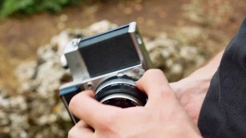 A man check the lens and vintage camera ... | Stock Video | Pond5