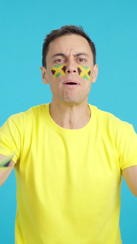 Man cheering for Jamaica screaming and w... | Stock Video | Pond5