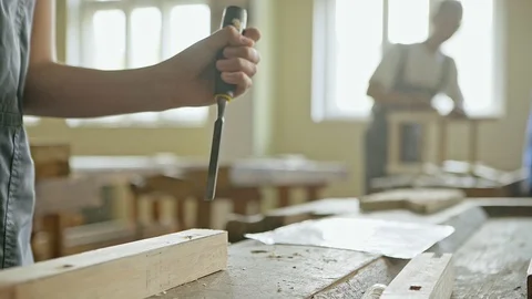 Man with chisel and hammer | Stock Video | Pond5