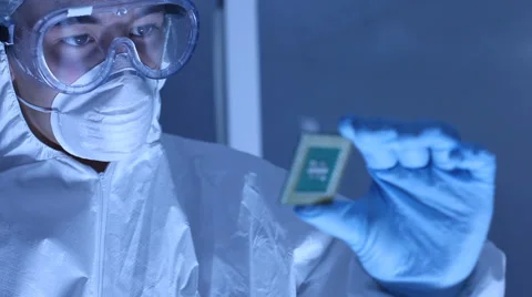 Man in clean room holds up computer cpu ... | Stock Video | Pond5