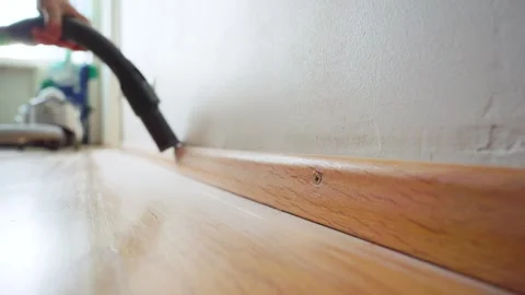 Man cleaning off the dust on a baseboard... | Stock Video | Pond5