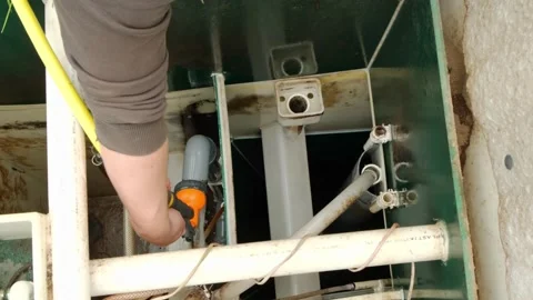 The man is cleaning septic. Maintenance ... | Stock Video | Pond5