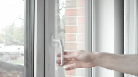 A man closes the frame of a slightly aja... | Stock Video | Pond5