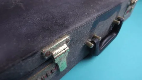 man closes old black dirty case on light... | Stock Video | Pond5
