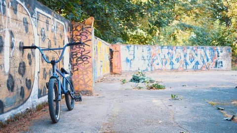 Man is coming closer to the BMX bike in ... | Stock Video | Pond5