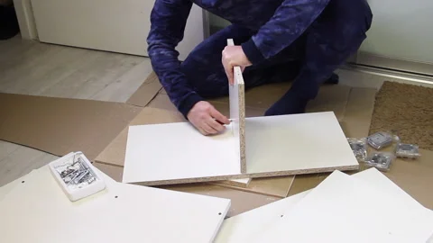 A man connects the panels with an eccent... | Stock Video | Pond5