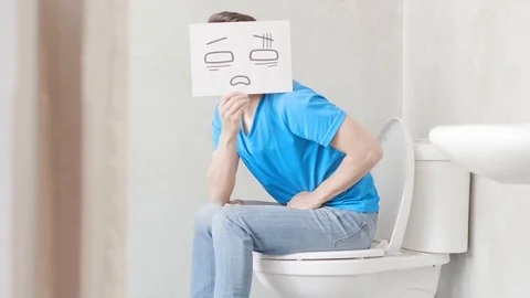 man with constipation on toilet | Stock Video | Pond5