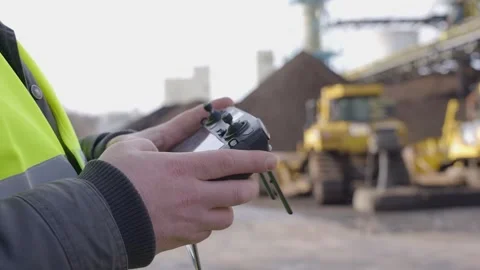 Man controlling a drone with his remote ... | Stock Video | Pond5