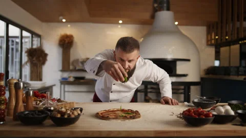 Man cooking pizza in italian food restau... | Stock Video | Pond5
