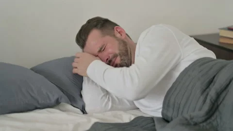 Man Crying while Sleeping in Bed | Stock Video | Pond5