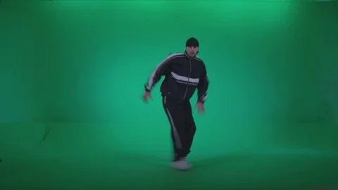 man dancing break dance on green screen | Stock Video | Pond5
