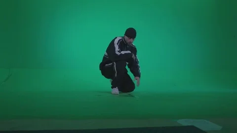 man dancing break dance on green screen | Stock Video | Pond5